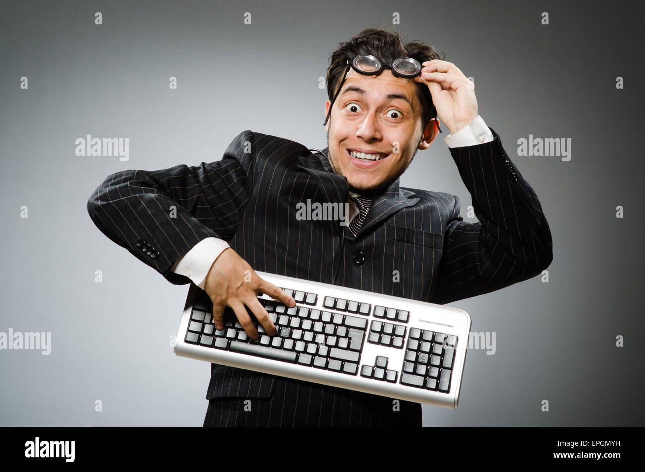 Comouter geek with computer keyboard Stock Photo - Alamy