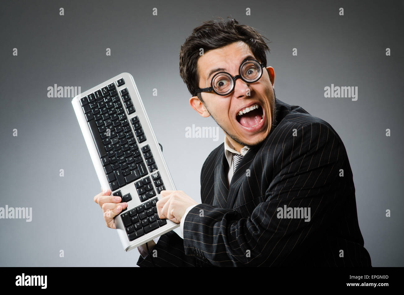 Comouter geek with computer keyboard Stock Photo - Alamy