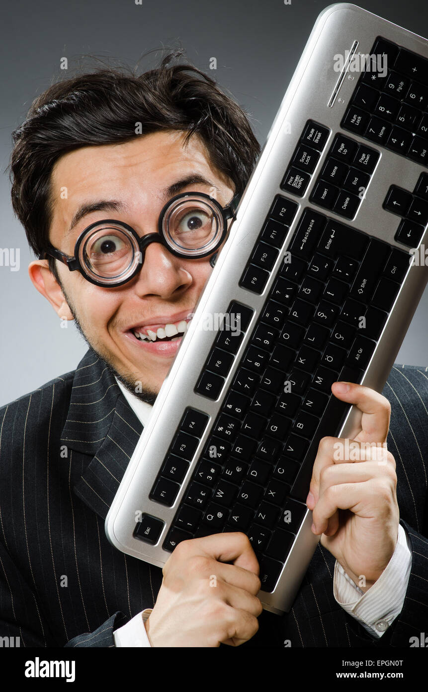 Comouter geek with computer keyboard Stock Photo - Alamy