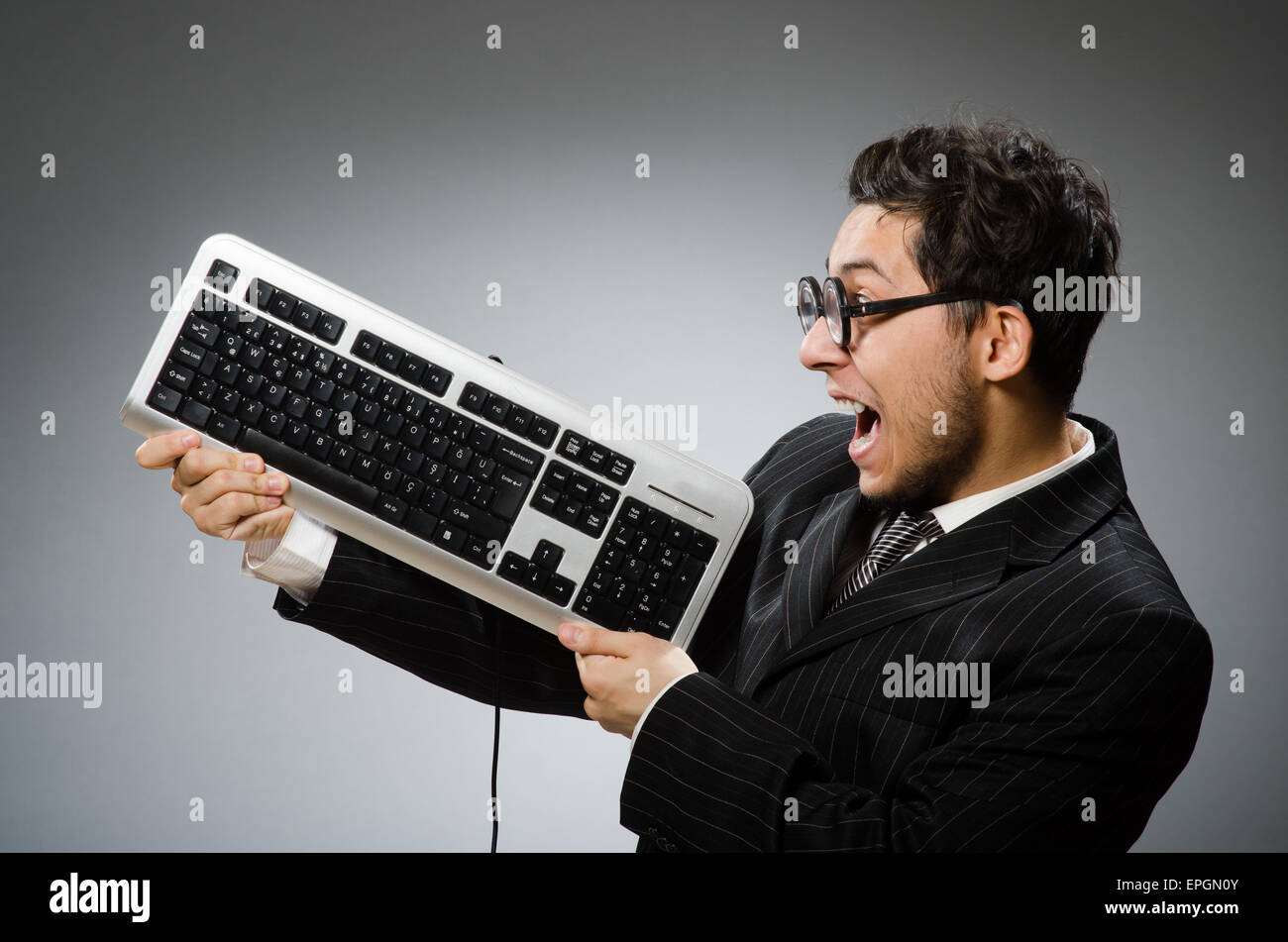 Comouter geek with computer keyboard Stock Photo - Alamy
