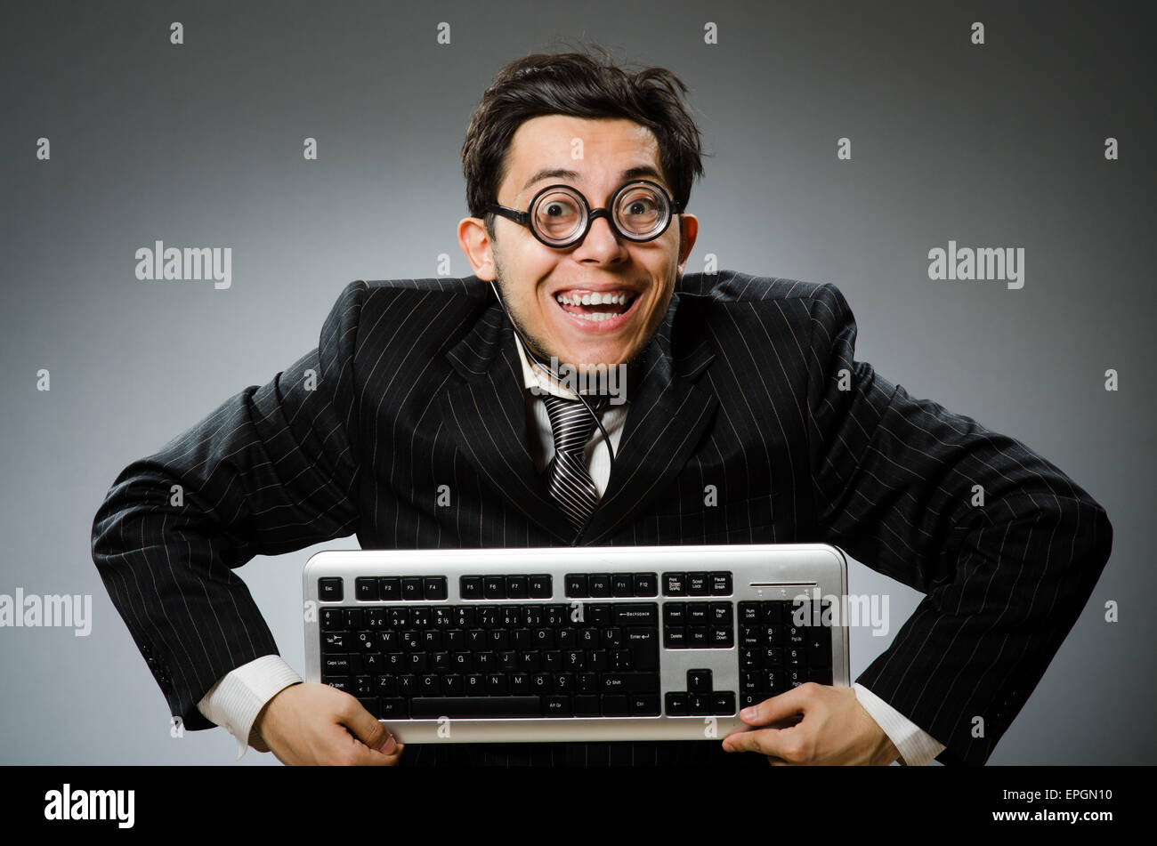 Comouter geek with computer keyboard Stock Photo - Alamy