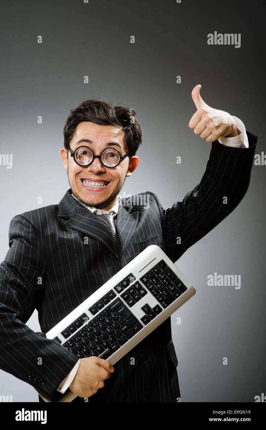 Comouter geek with computer keyboard Stock Photo - Alamy