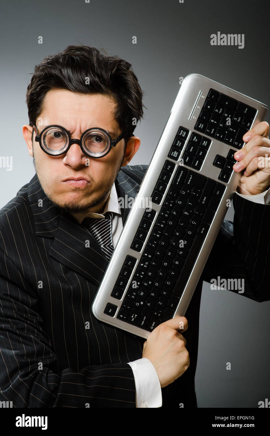 Comouter geek with computer keyboard Stock Photo - Alamy