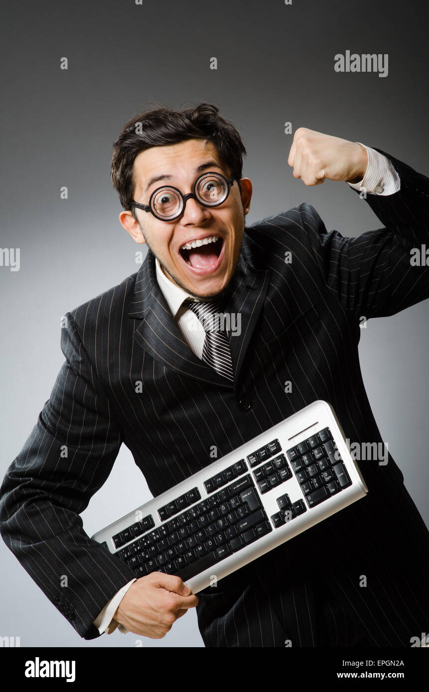 Comouter geek with computer keyboard Stock Photo - Alamy