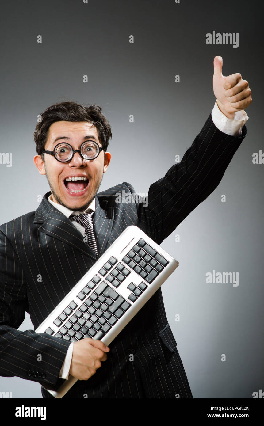 Comouter geek with computer keyboard Stock Photo - Alamy