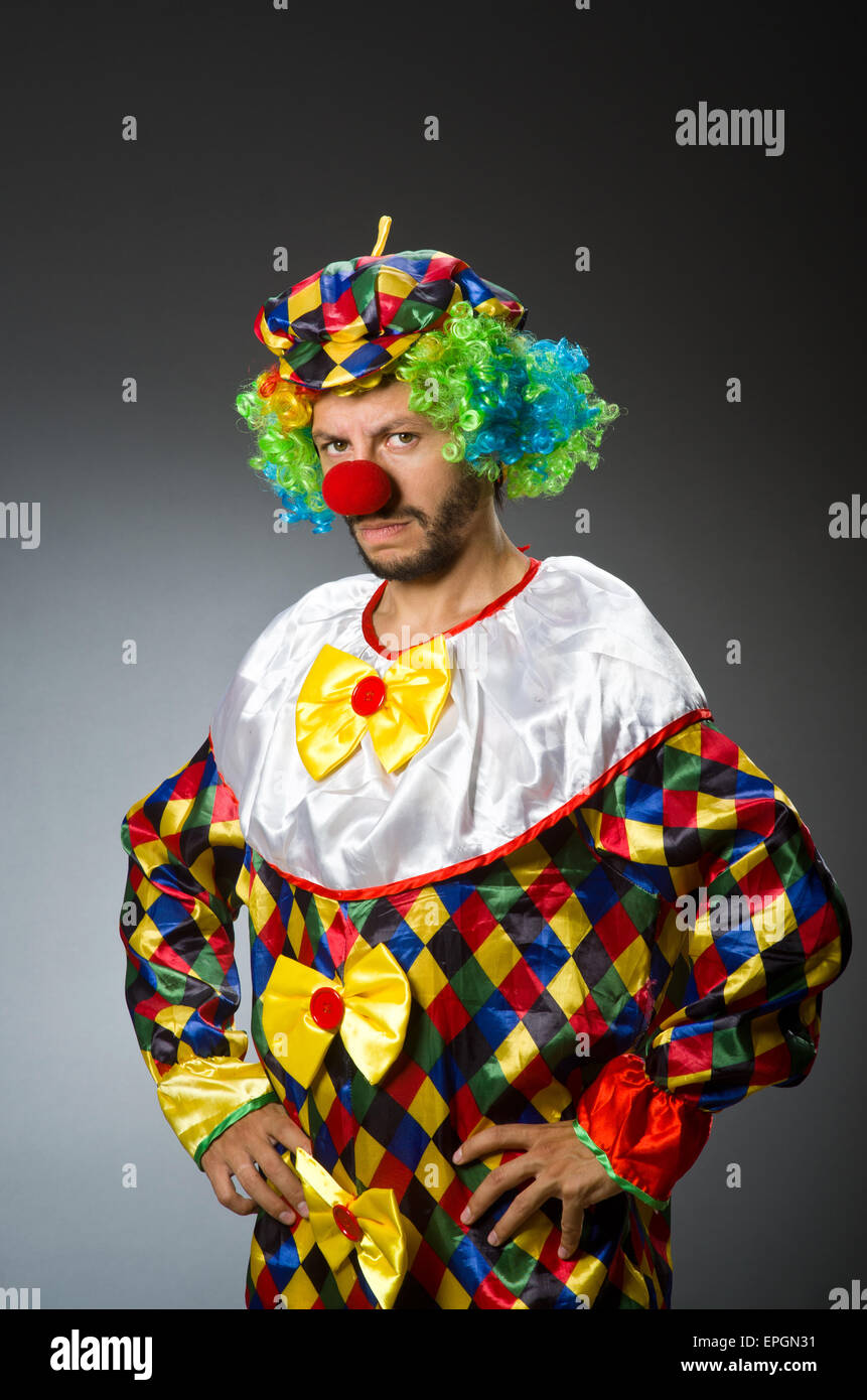 Funny clown in colourful costume Stock Photo - Alamy