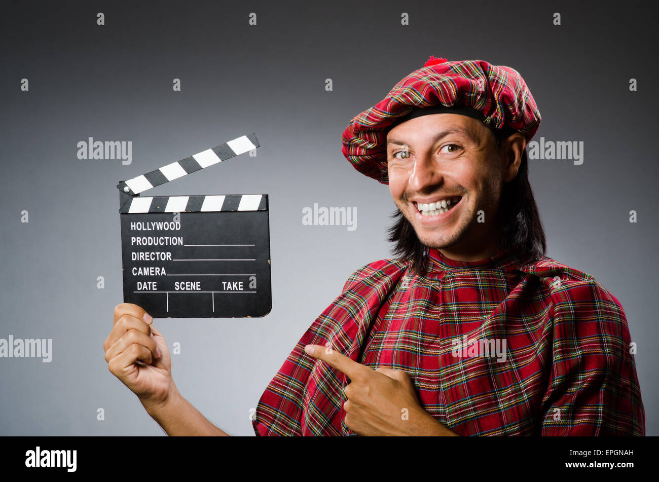 Funny scotsman with movie clapboard Stock Photo - Alamy