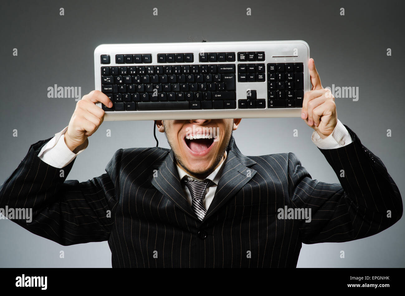 Comouter geek with computer keyboard Stock Photo - Alamy