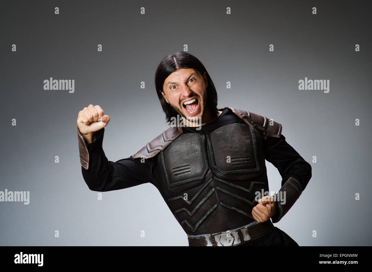 Angry warrior against dark background Stock Photo - Alamy