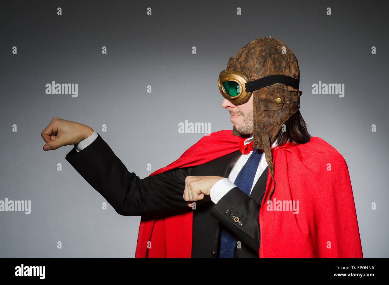 Superman concept with man in red cover Stock Photo - Alamy