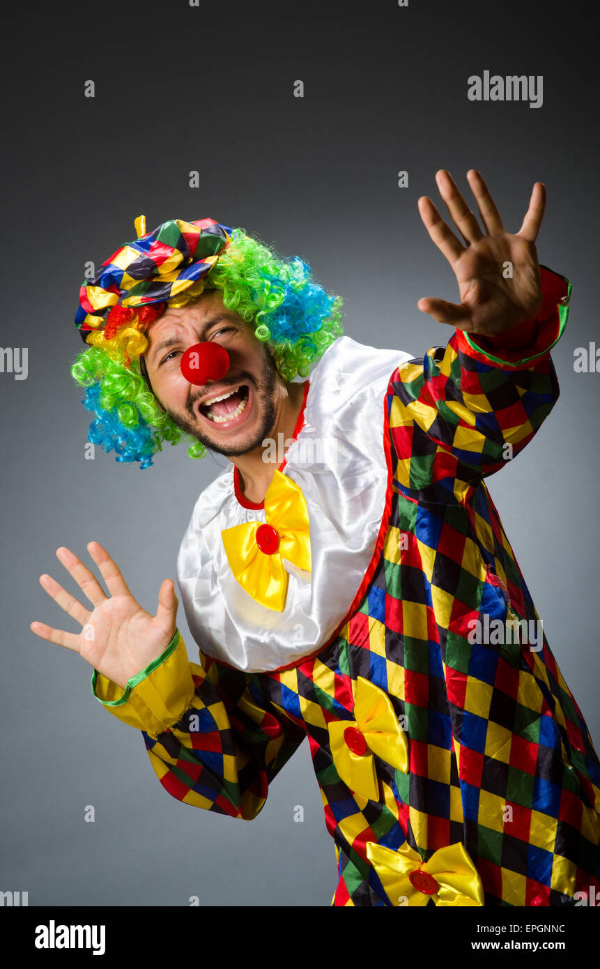 Funny clown in colourful costume Stock Photo - Alamy