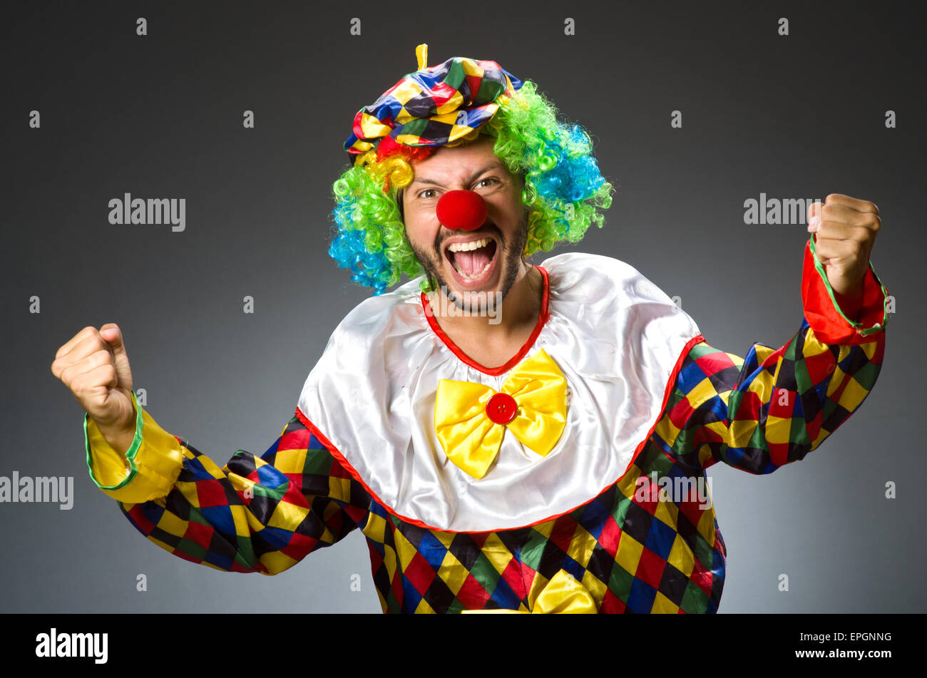 Funny clown in colourful costume Stock Photo - Alamy