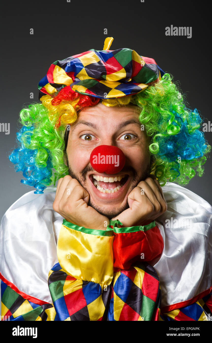 Funny clown in colourful costume Stock Photo - Alamy