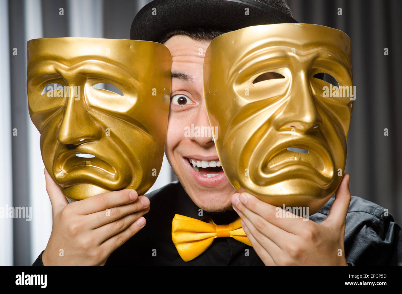 Funny concept with theatrical mask Stock Photo - Alamy