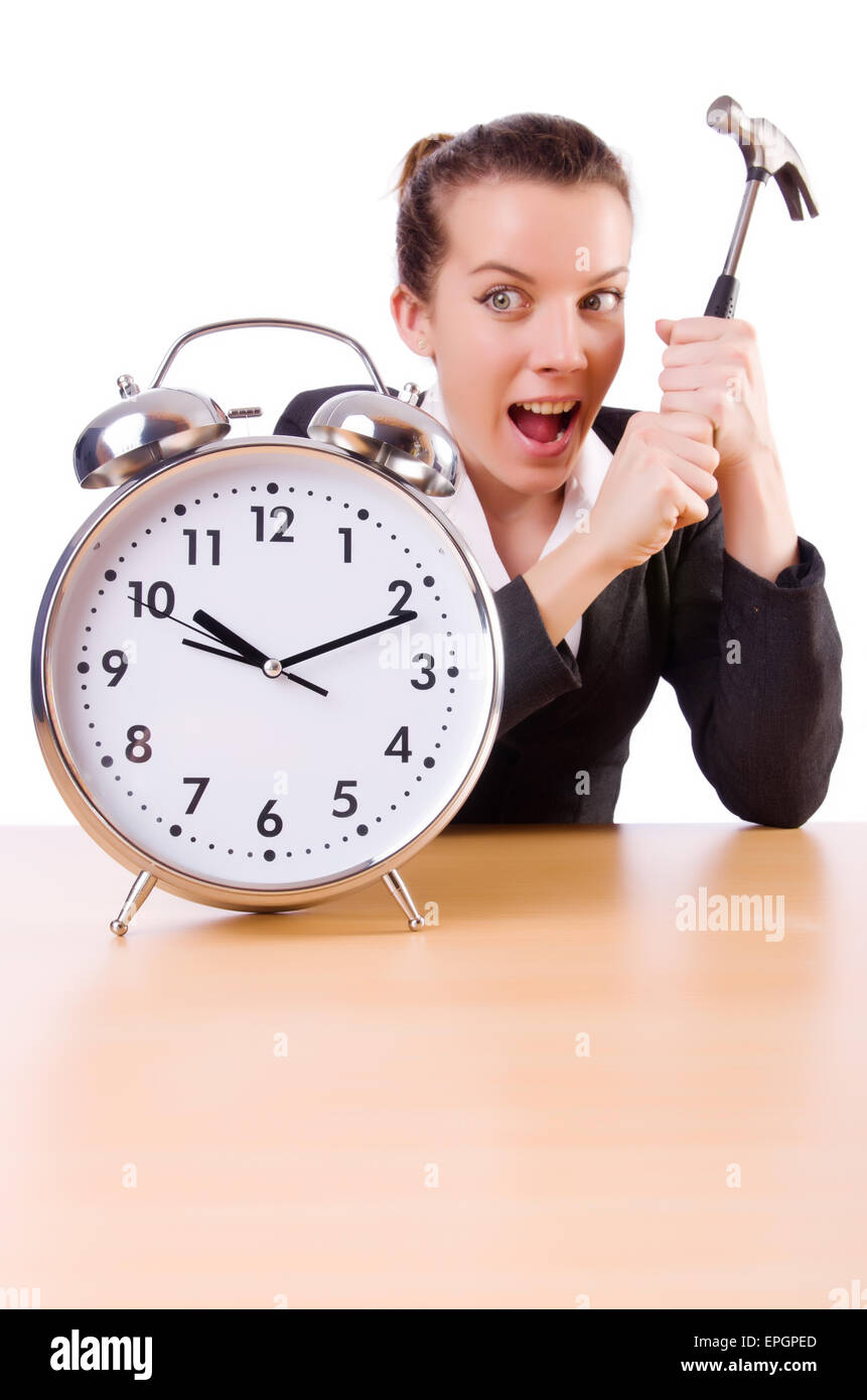 Woman desperate with time hitting clock with hammer Stock Photo - Alamy