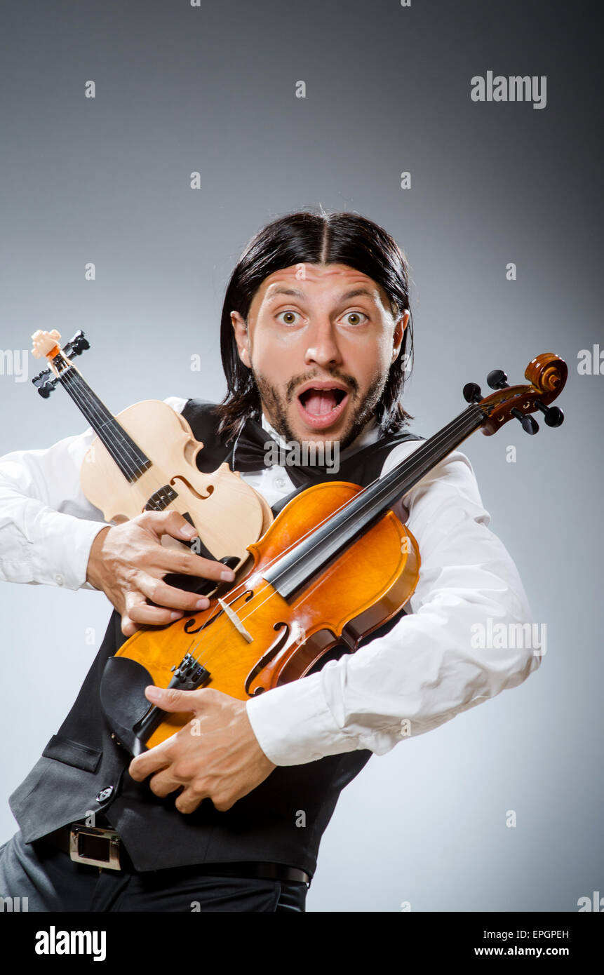 Funny fiddle violin player in musical concept Stock Photo - Alamy