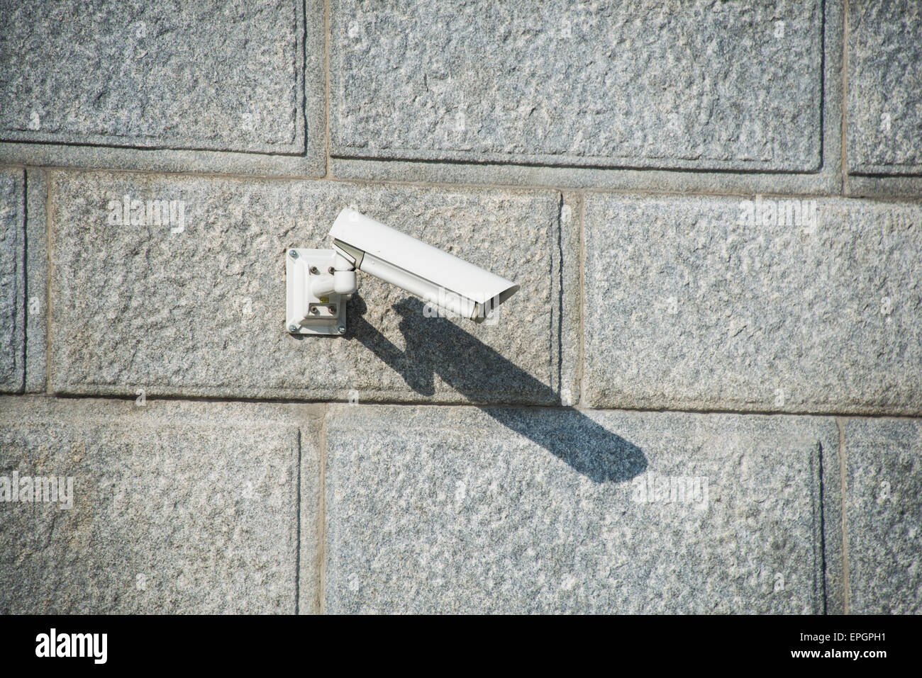 Security camera attached to the wall Stock Photo - Alamy