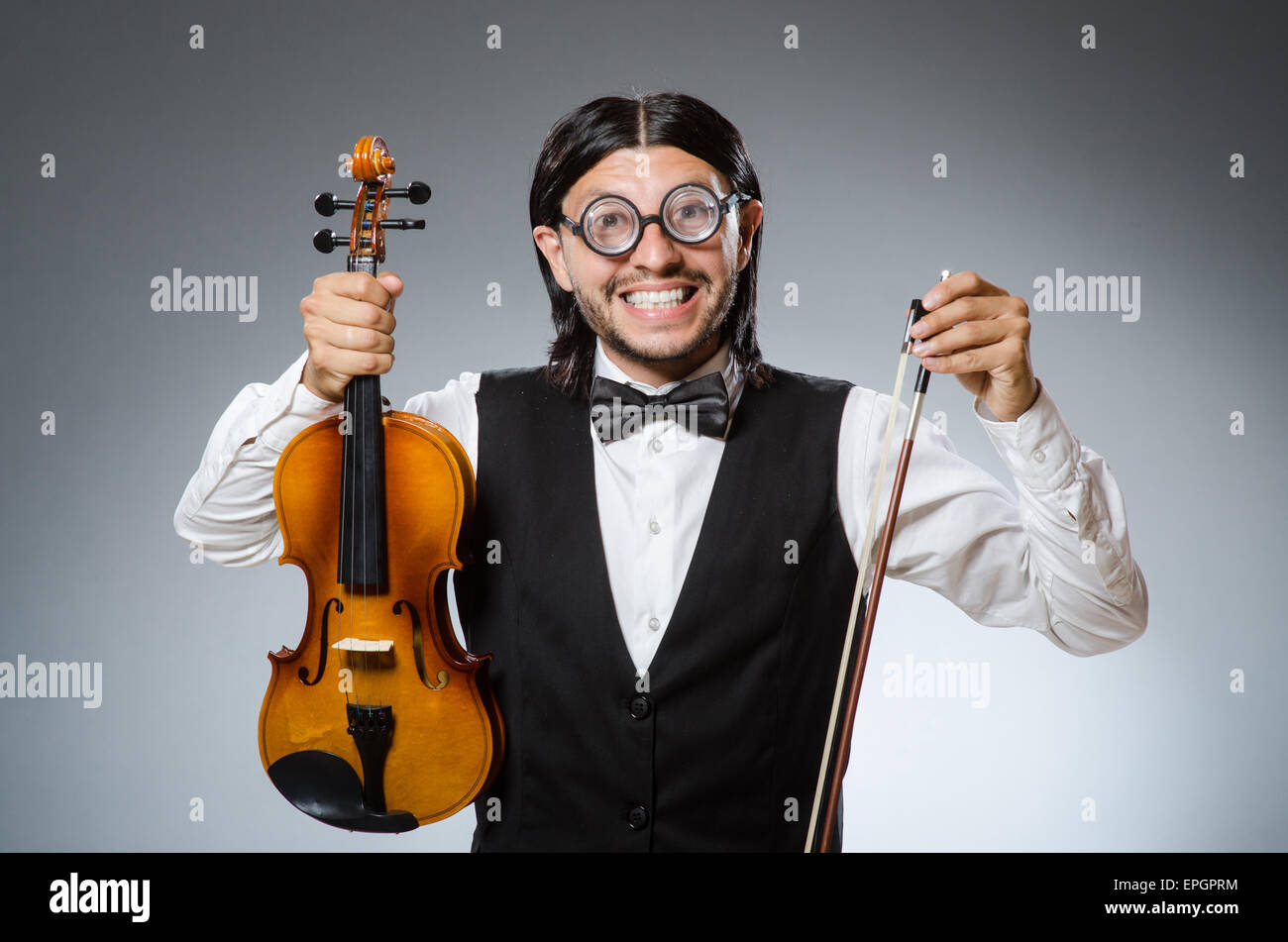 Funny fiddle violin player in musical concept Stock Photo - Alamy