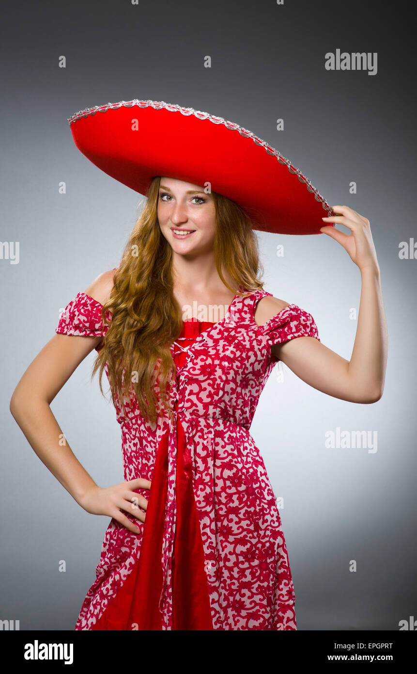 Mexican woman wearing red sombrero Stock Photo - Alamy