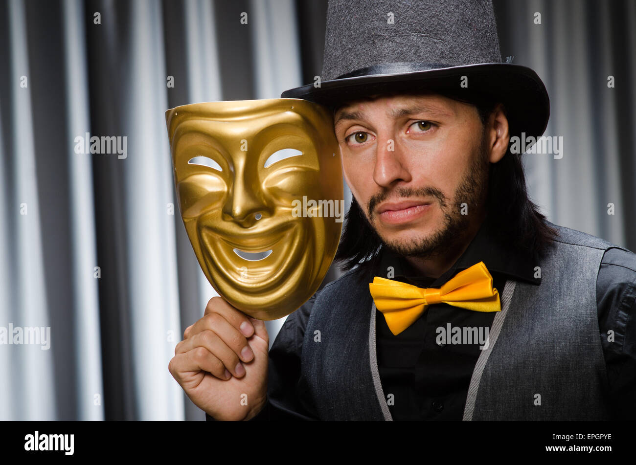 Funny concept with theatrical mask Stock Photo - Alamy