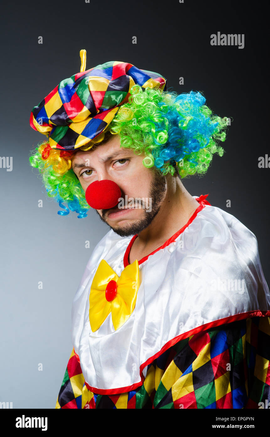 Funny clown in colourful costume Stock Photo - Alamy