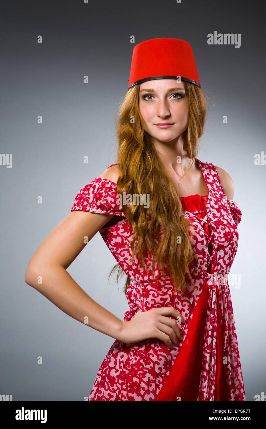 Woman wearing red fez hat Stock Photo - Alamy
