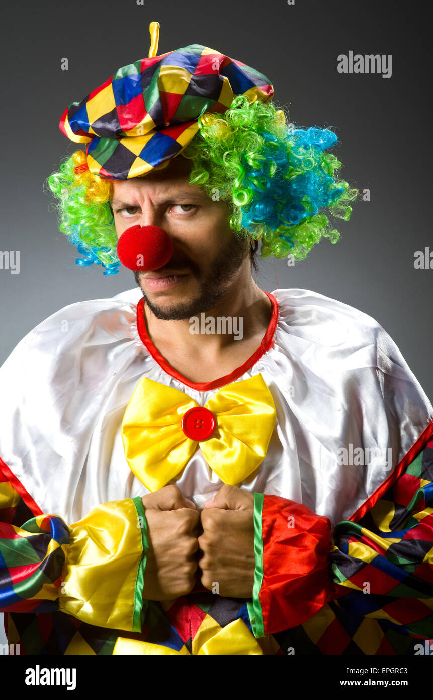 Funny clown in colourful costume Stock Photo - Alamy