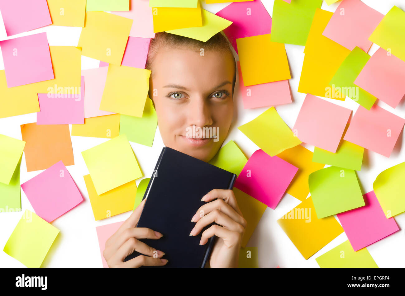 Woman with many reminder notes reading book Stock Photo - Alamy