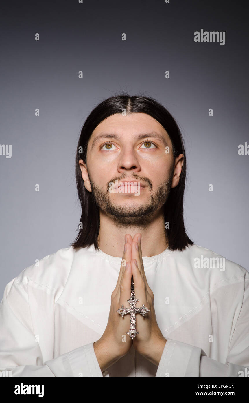 Priest man in religious concept Stock Photo - Alamy