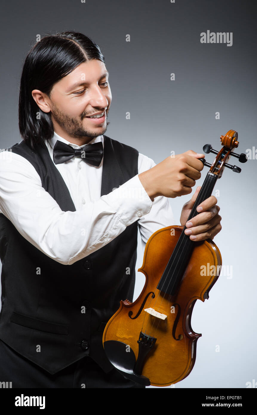 Funny fiddle violin player in musical concept Stock Photo - Alamy