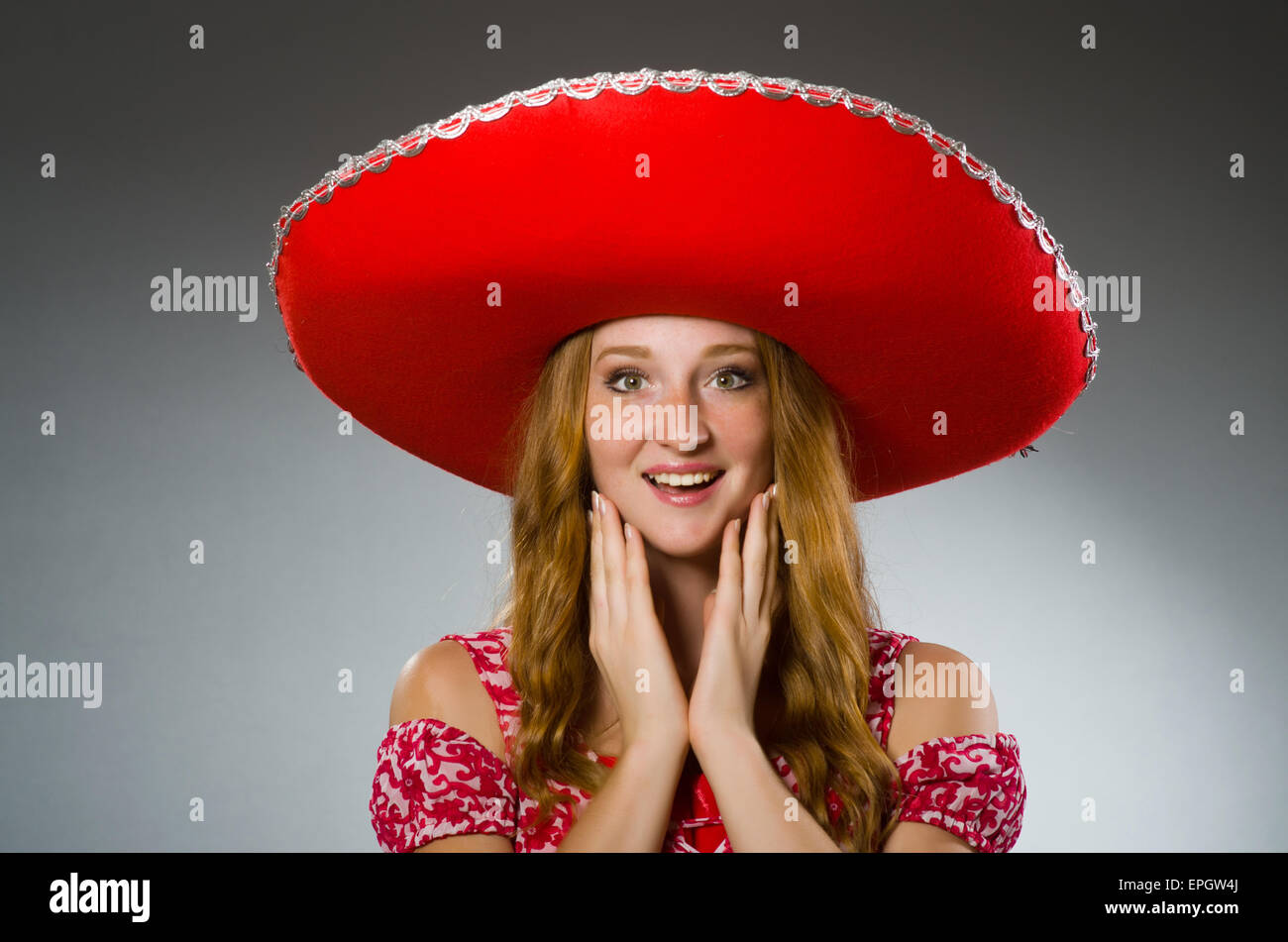 Mexican woman wearing red sombrero Stock Photo - Alamy