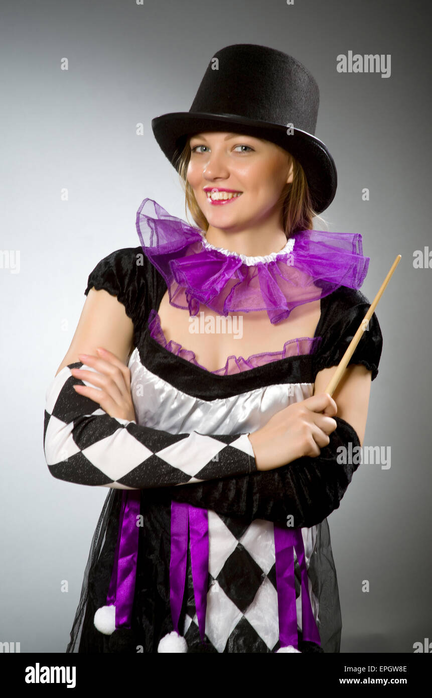 Woman magician doing her tricks with wand Stock Photo - Alamy