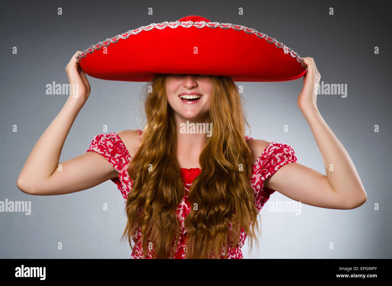Mexican woman wearing red sombrero Stock Photo - Alamy