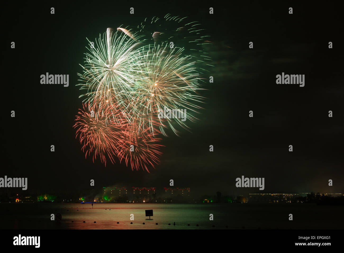 Brightly exploding fireworks lighting hi-res stock photography and ...