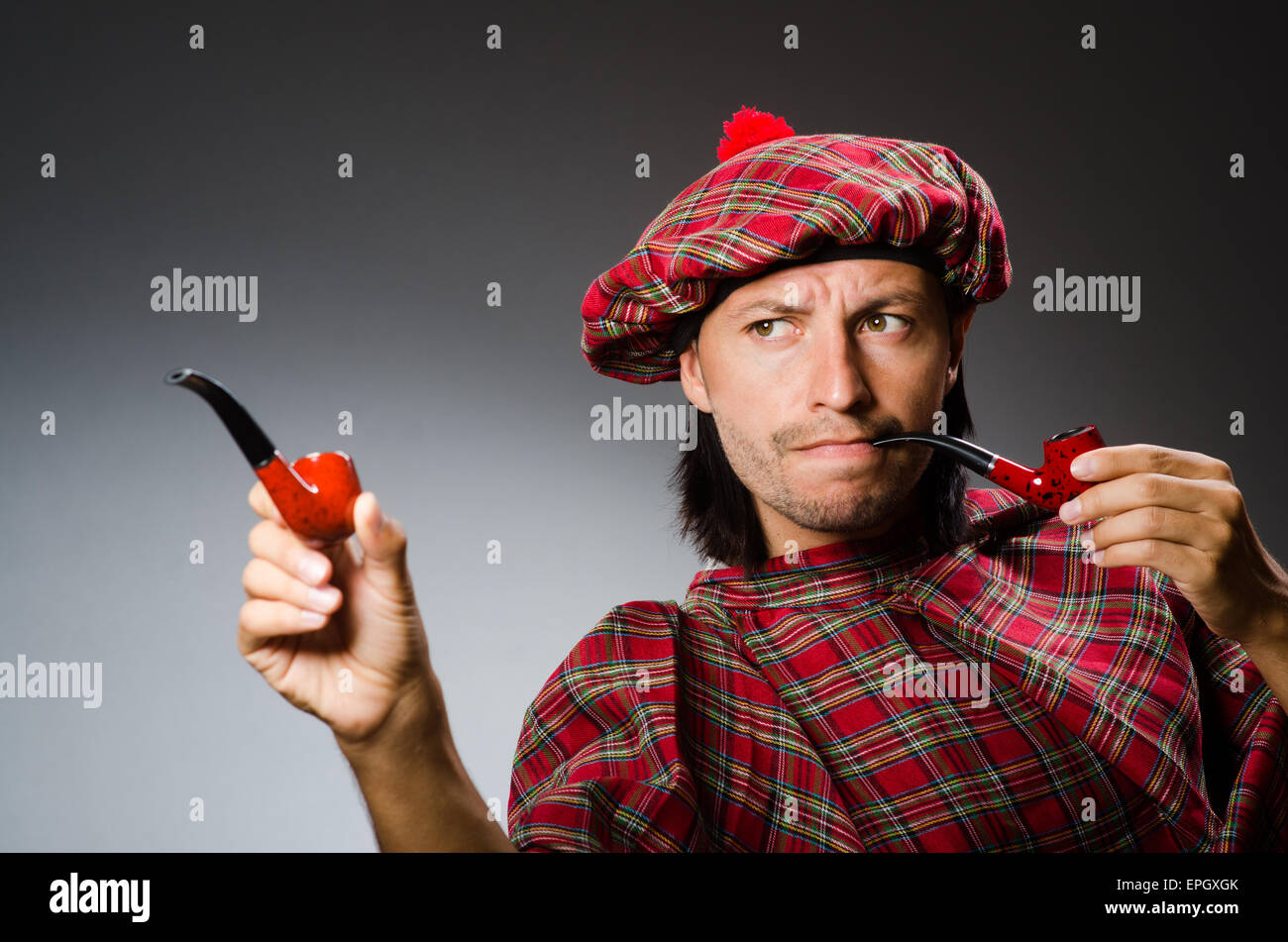 Funny scotsman with smoking pipe Stock Photo - Alamy
