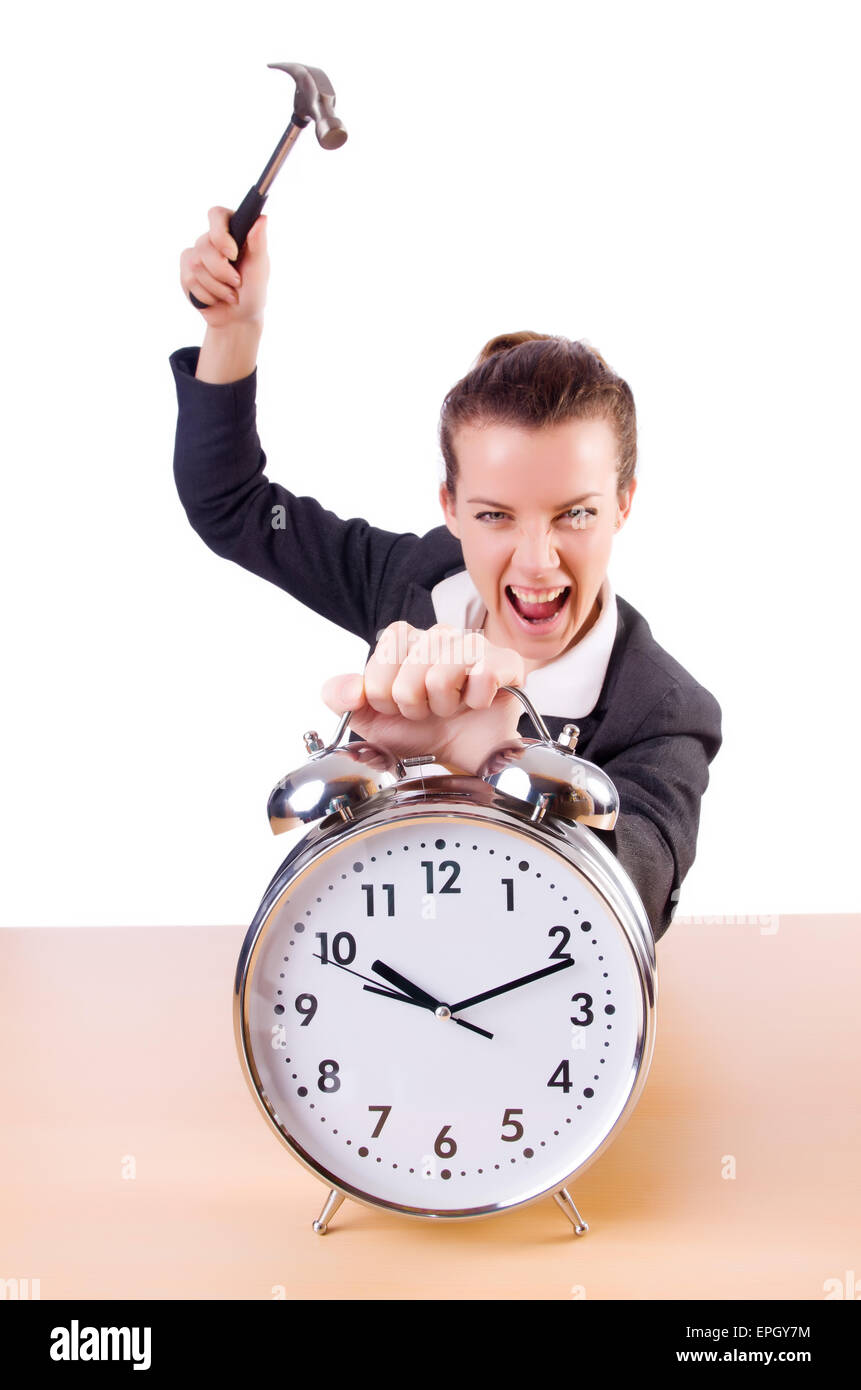Woman desperate with time hitting clock with hammer Stock Photo - Alamy