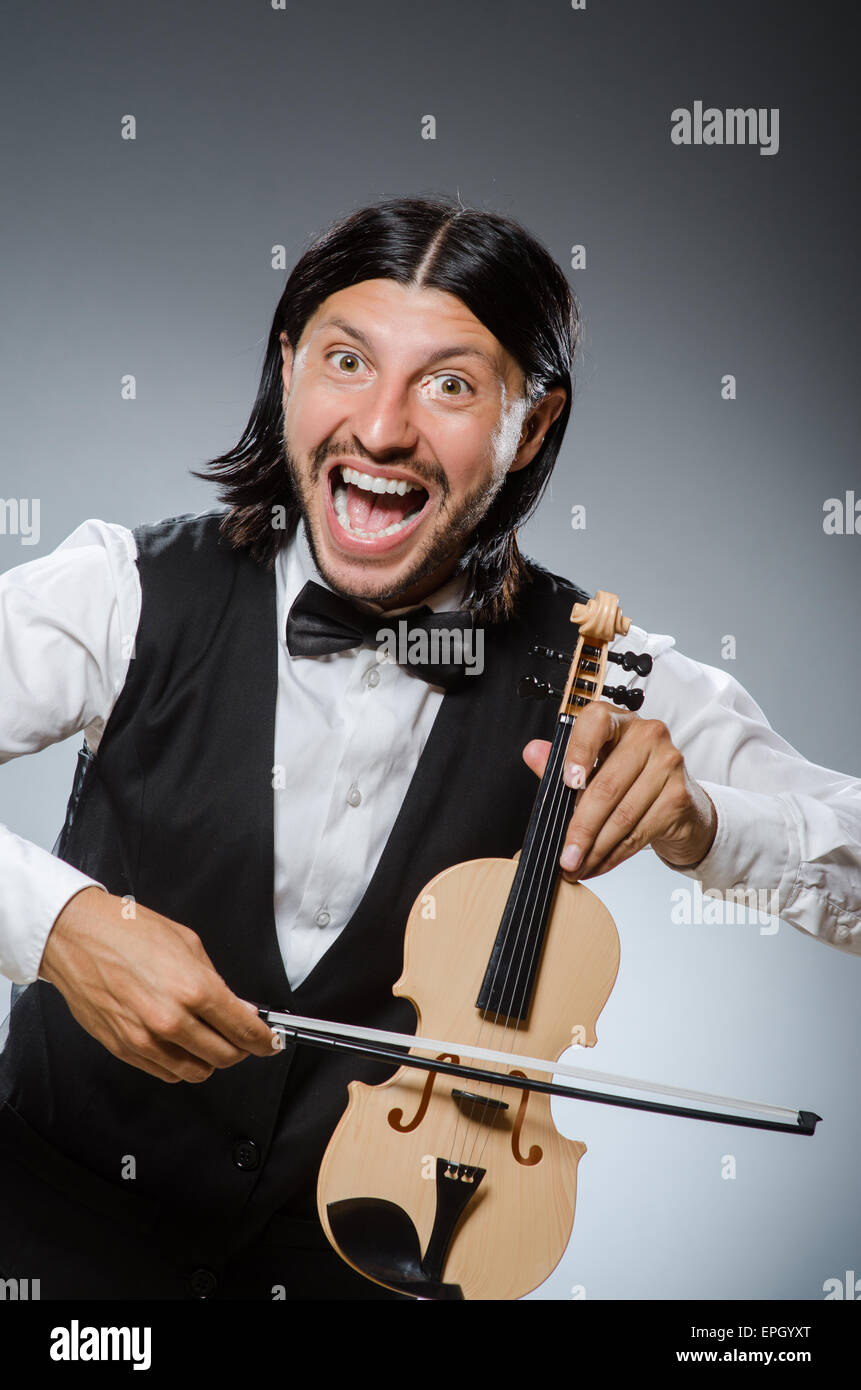 Funny fiddle violin player in musical concept Stock Photo - Alamy