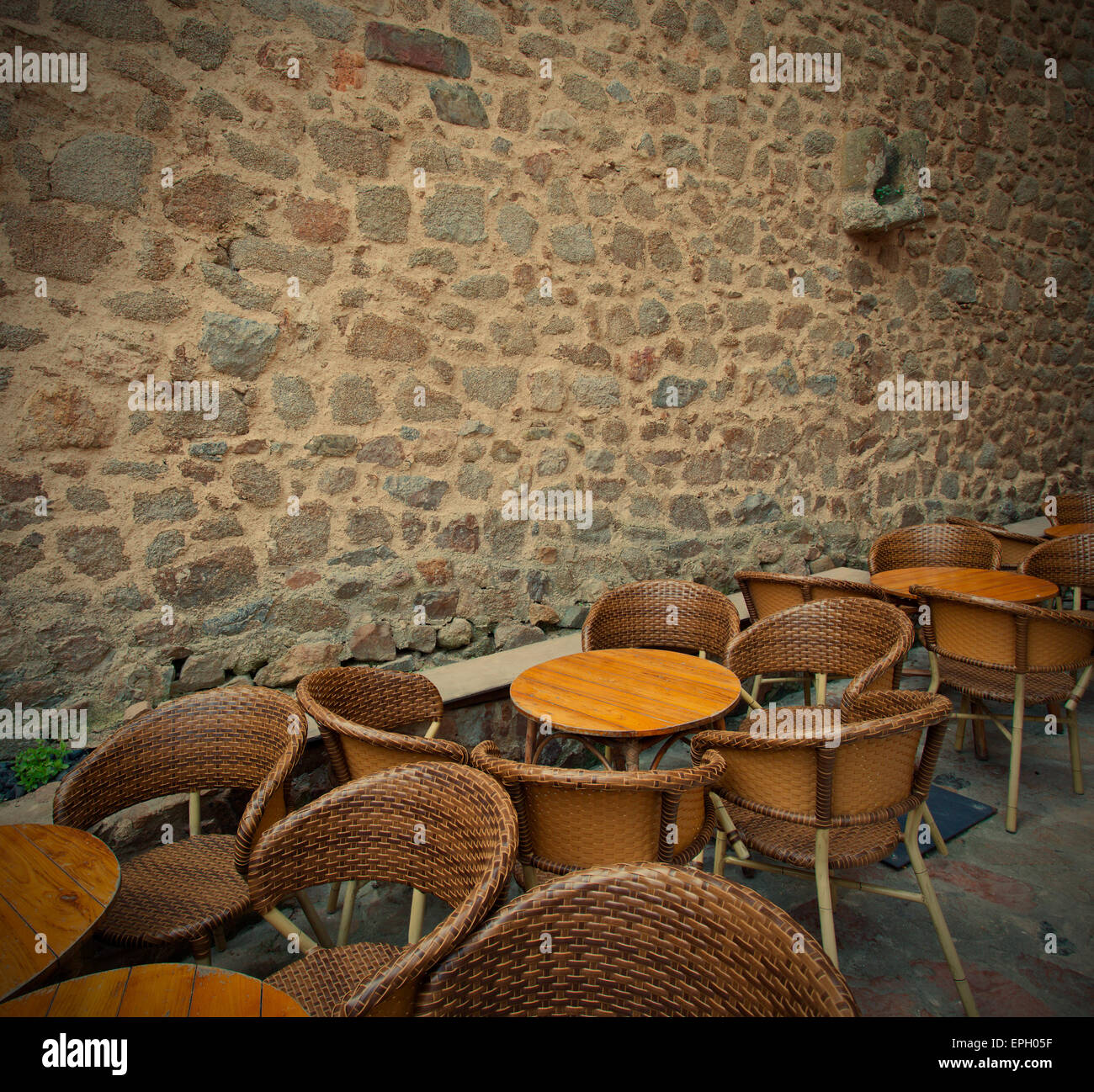 summer cafe near the ancient stone wall Stock Photo - Alamy