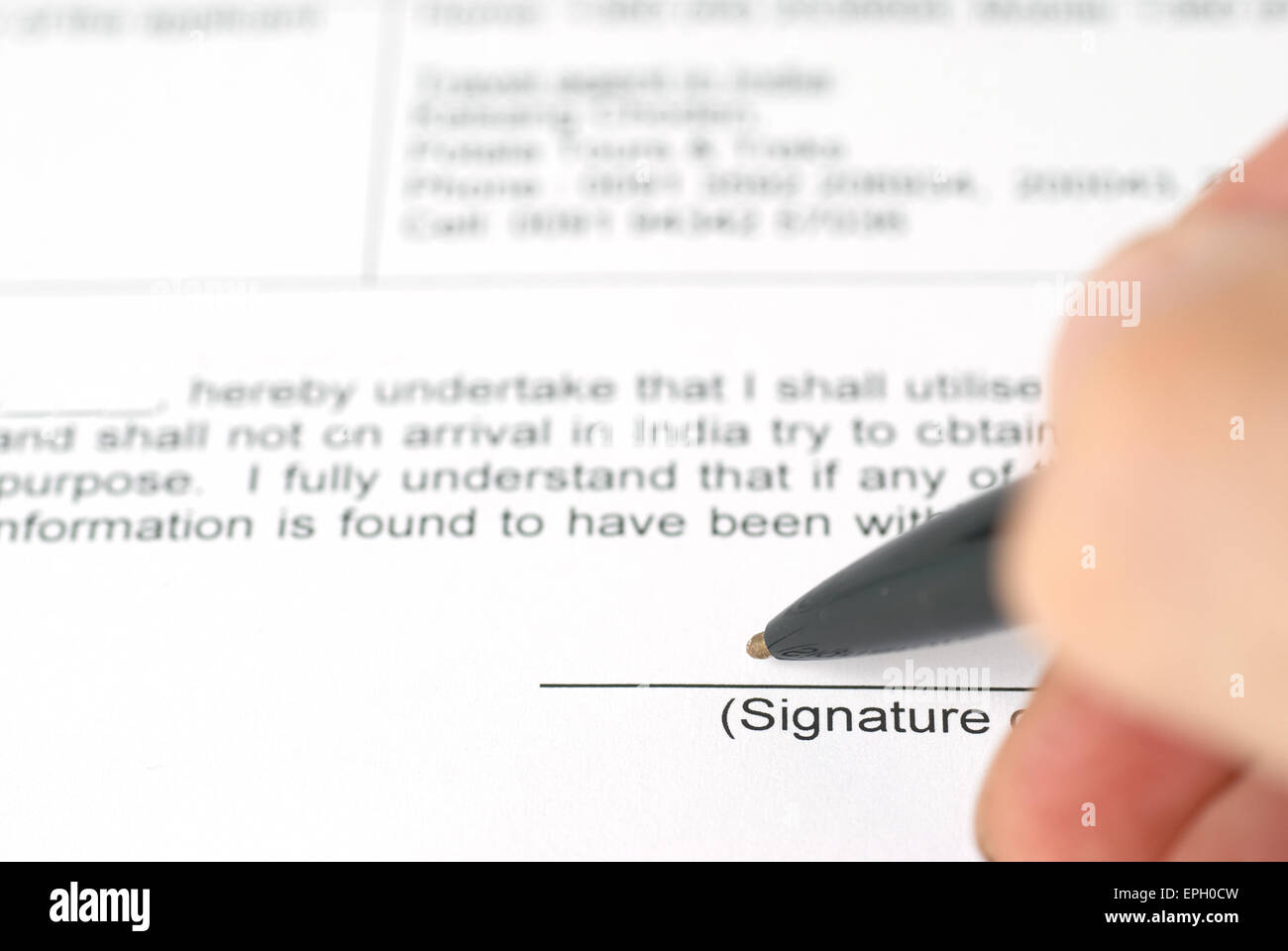 Pen signing contract Stock Photo - Alamy