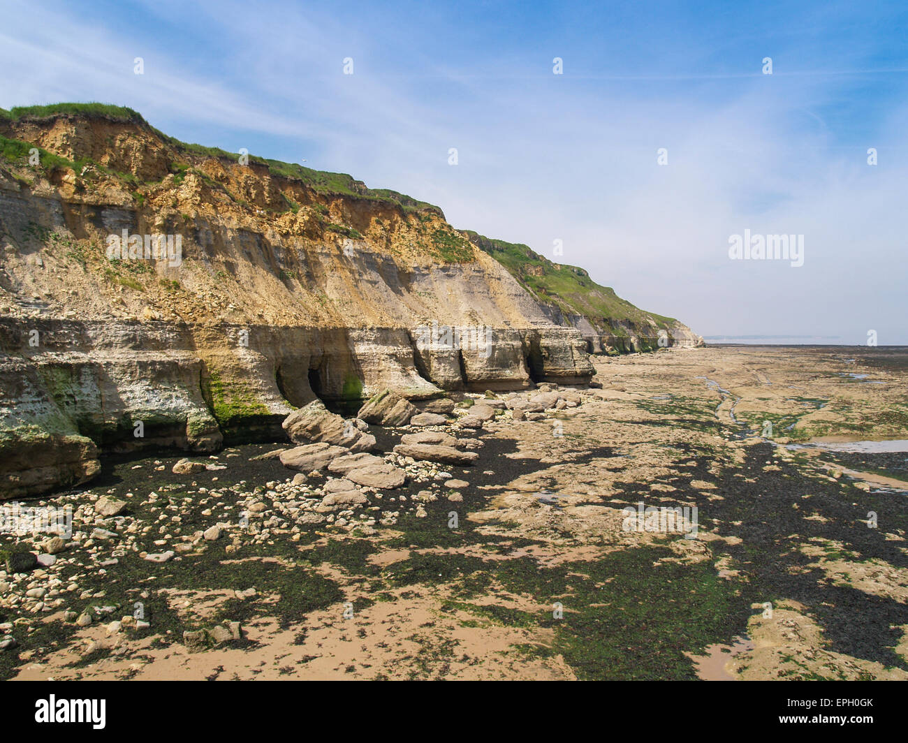 Cliff face rocks at on beach at Arromanches, Normandy France Stock ...