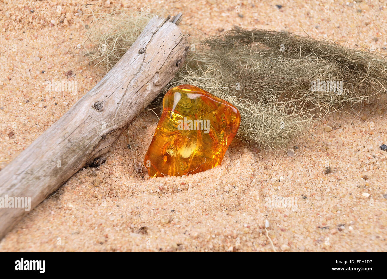 Amber on beach Stock Photo - Alamy