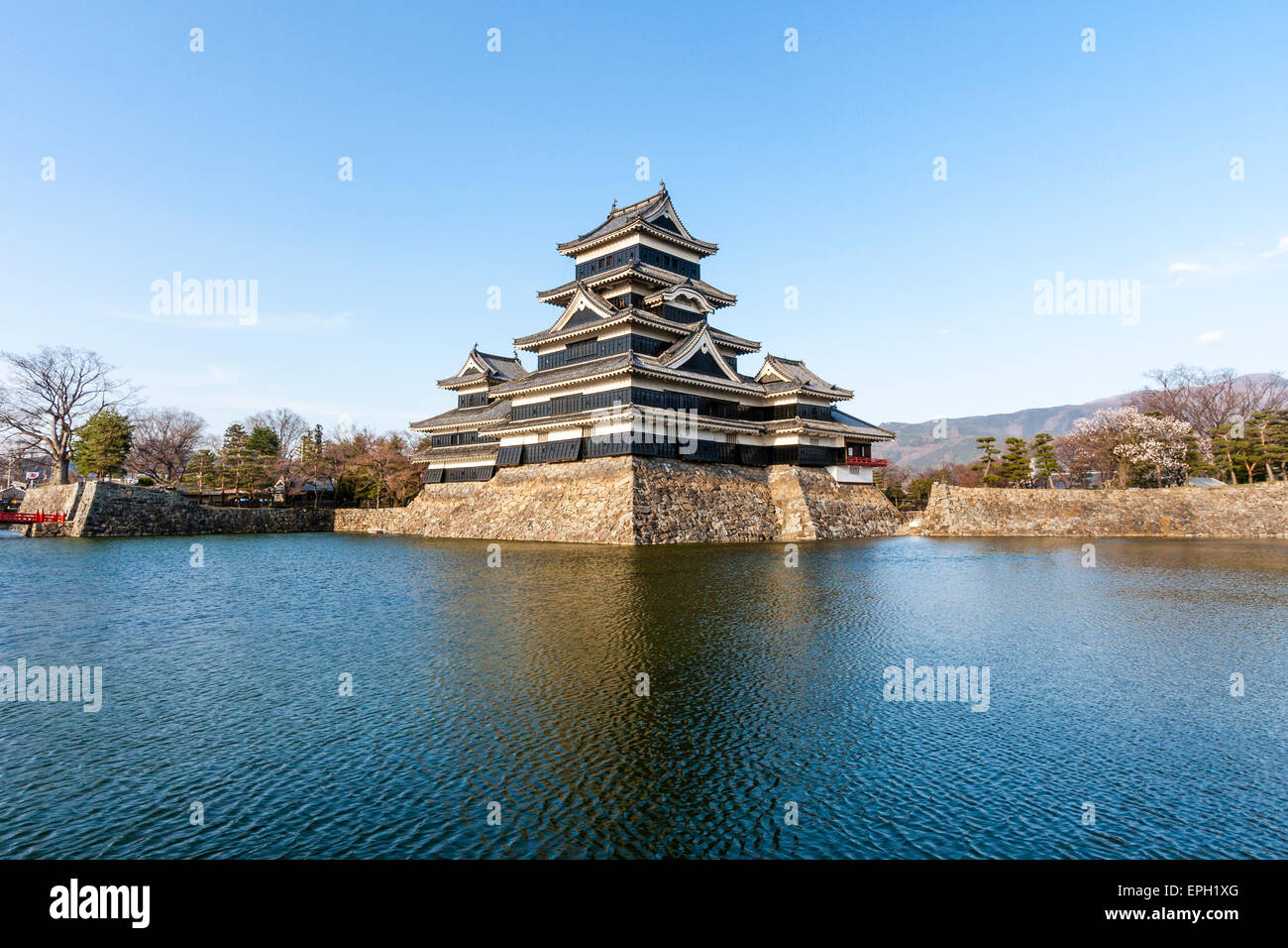 The Japanese castle at Mastumoto in white plaster with black weather ...