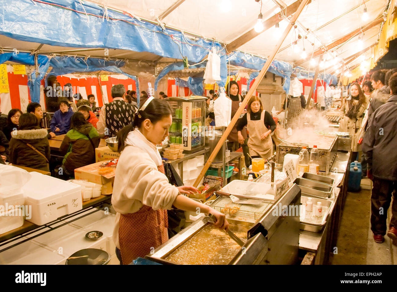 New year's eve, Omisoka, at Japanese shrine. View along large tented ...