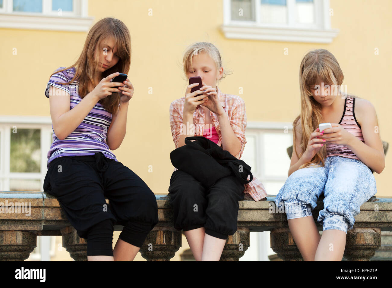 Group of school girls calling on the cell phones Stock Photo - Alamy