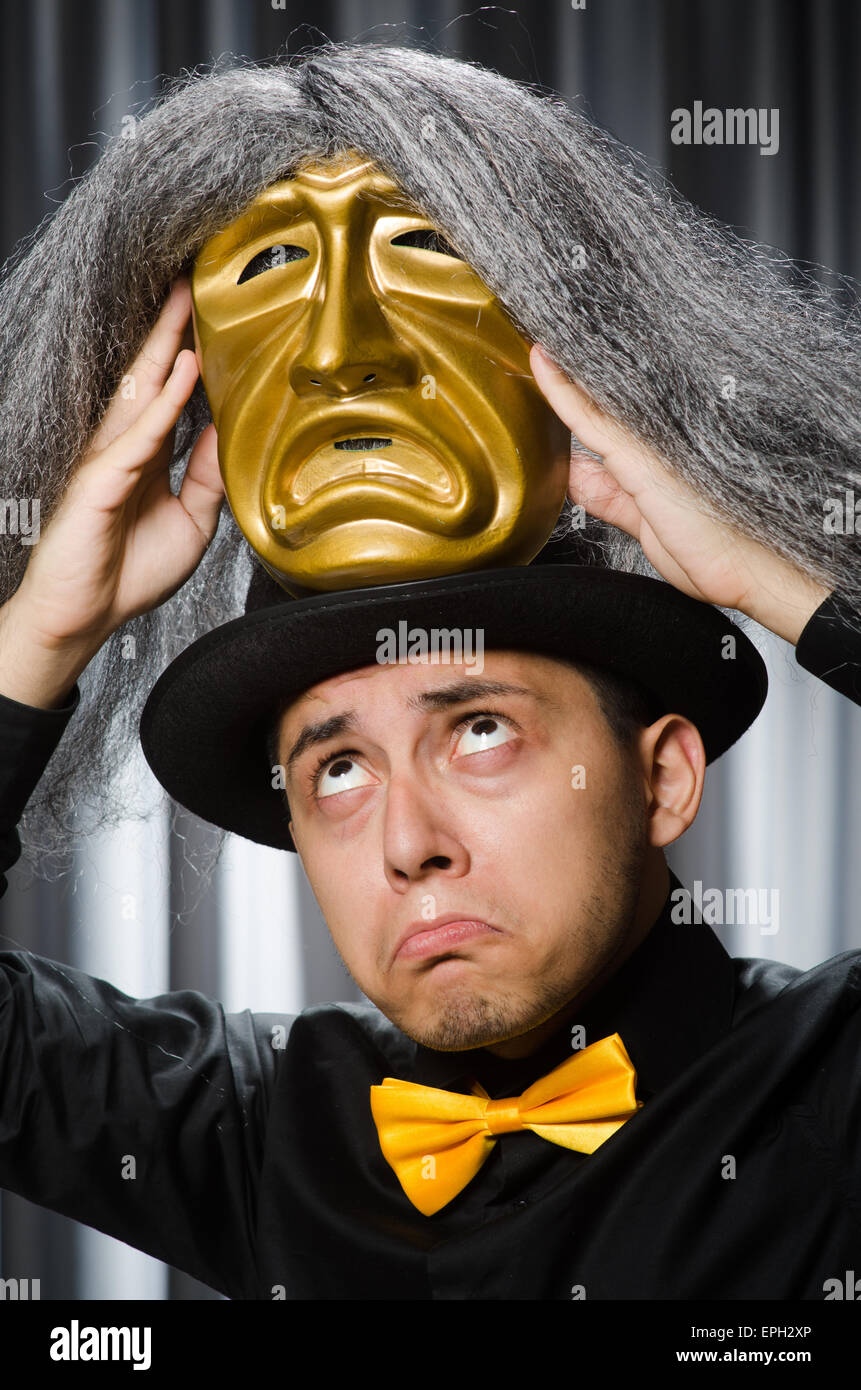 Funny concept with theatrical mask Stock Photo - Alamy