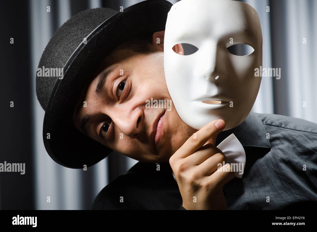 Funny concept with theatrical mask Stock Photo - Alamy