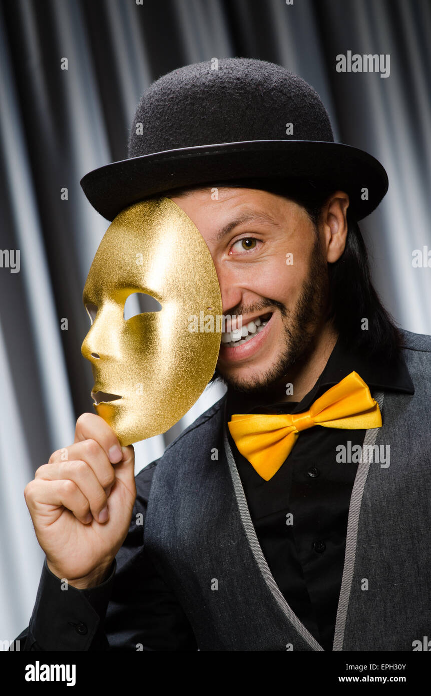 Funny concept with theatrical mask Stock Photo - Alamy