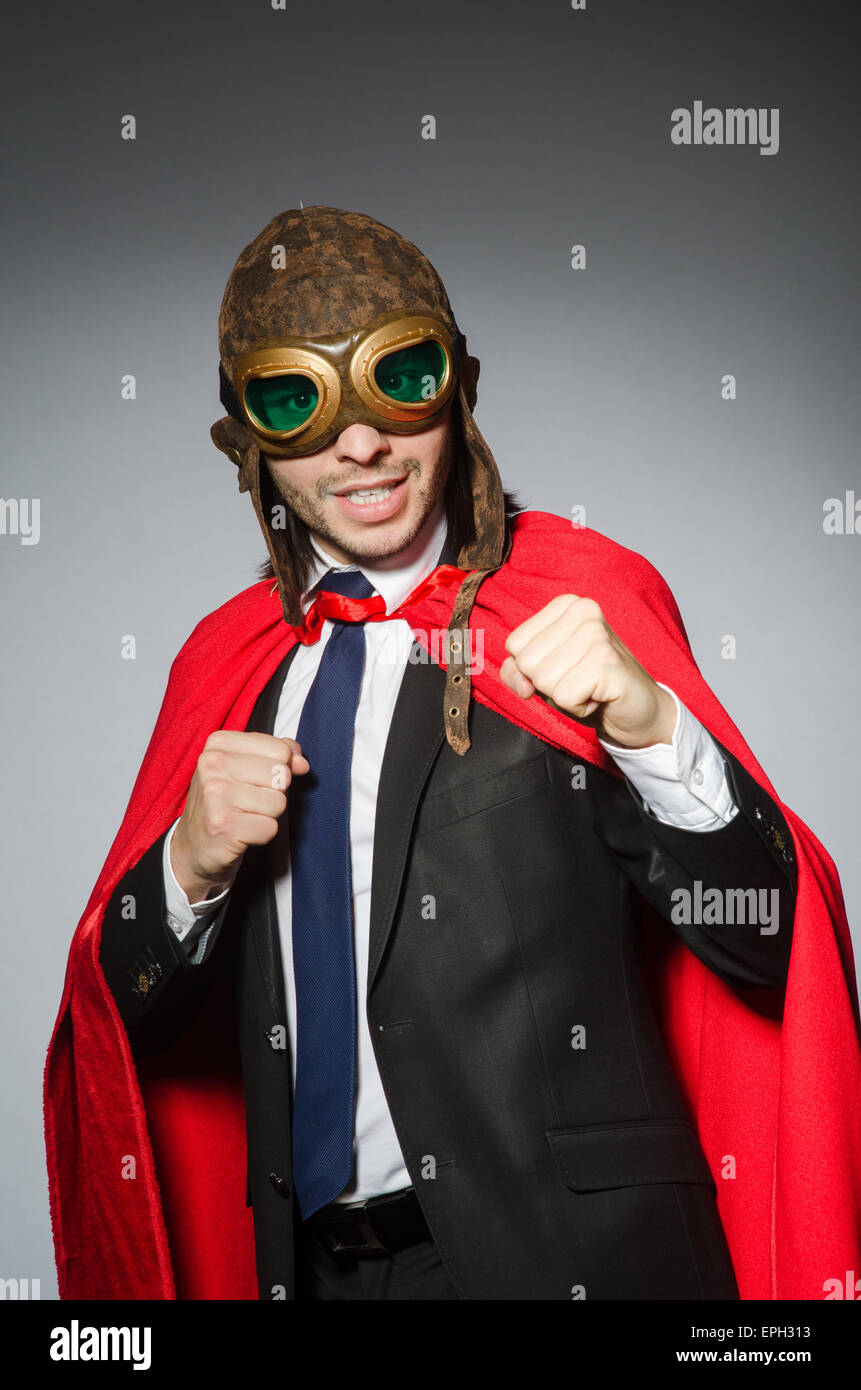 Superman concept with man in red cover Stock Photo - Alamy