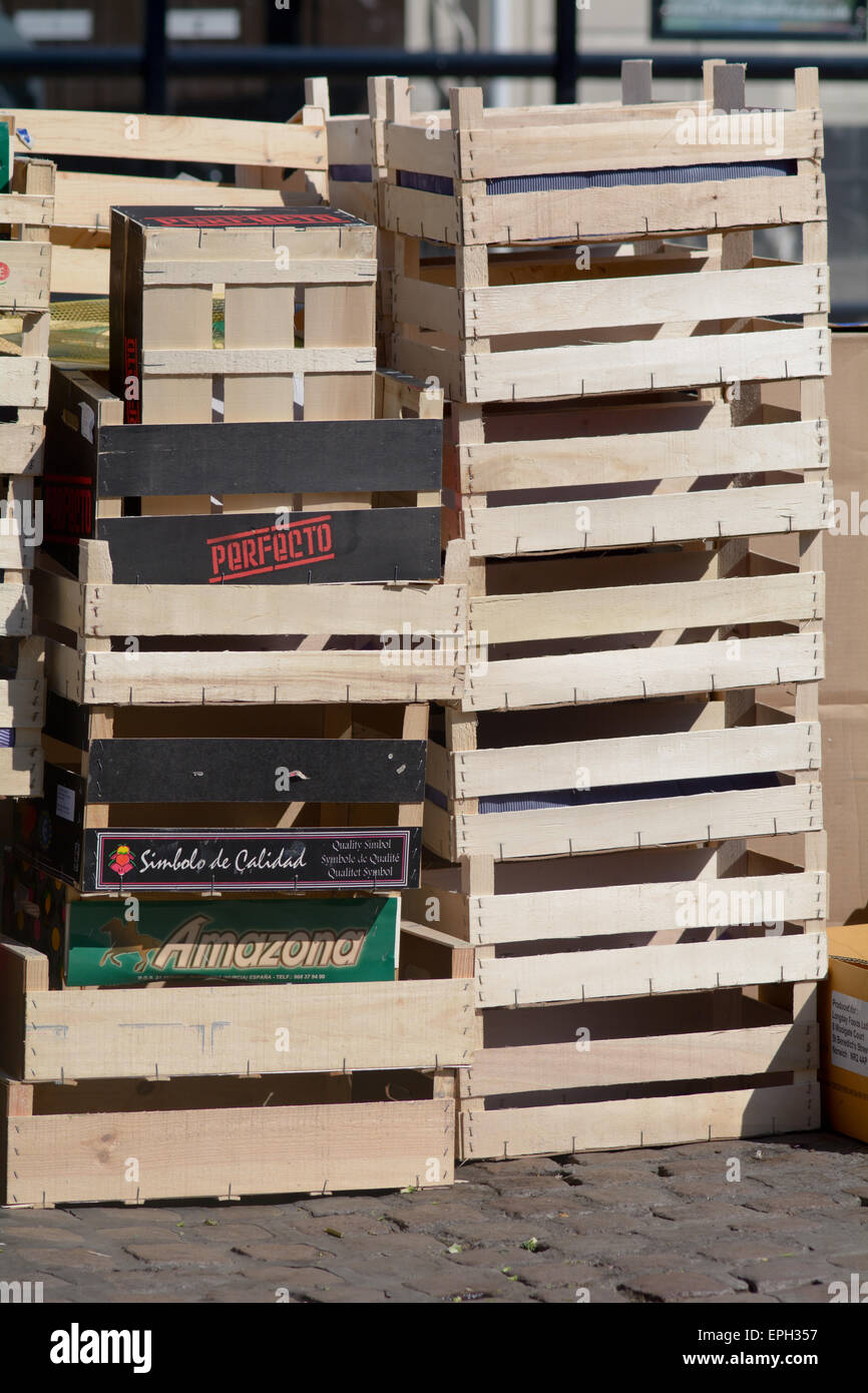 Empty fruit and vegetable wooden crates and cardboard boxes at bi ...