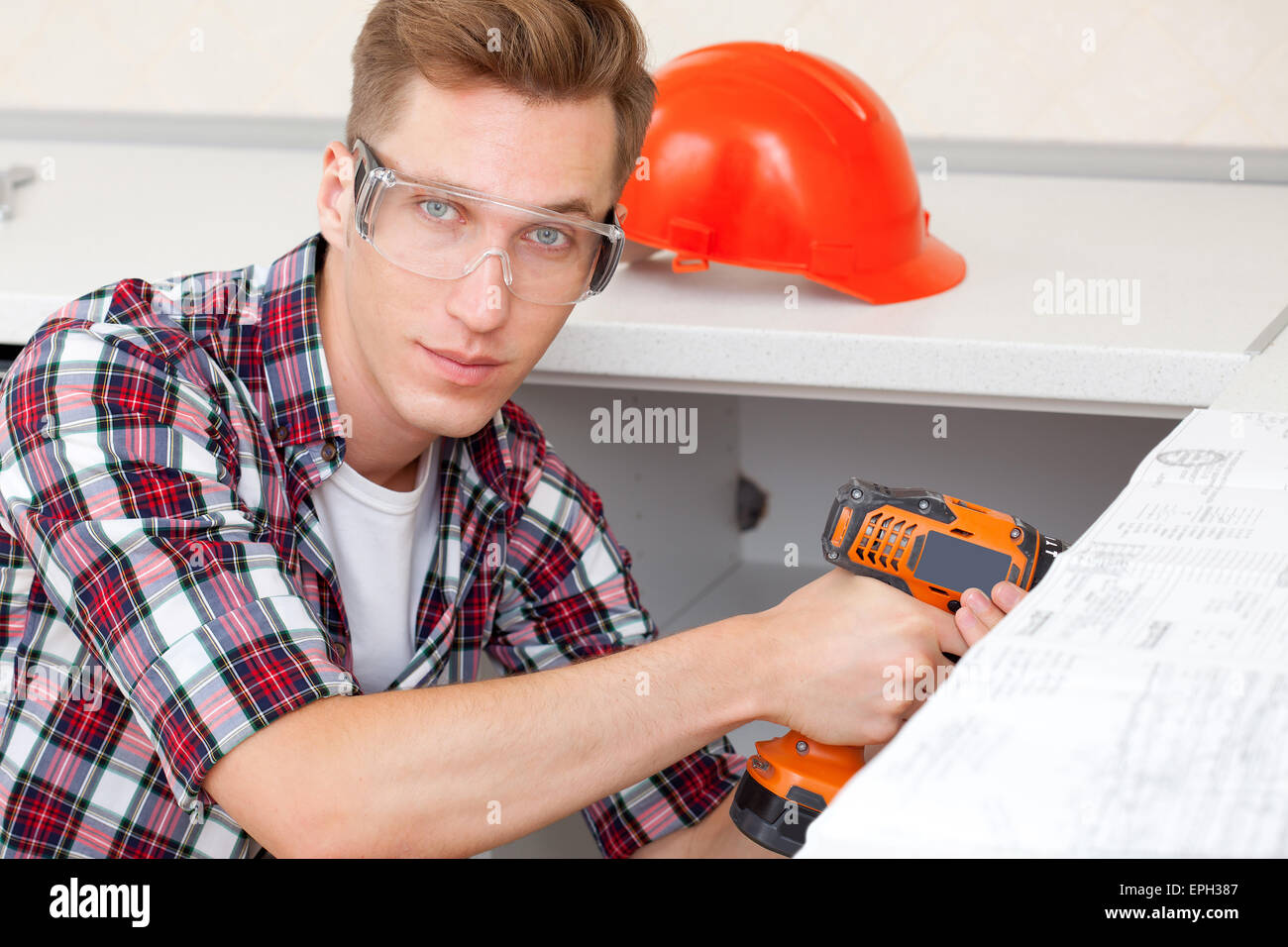 young worker with drill Stock Photo - Alamy